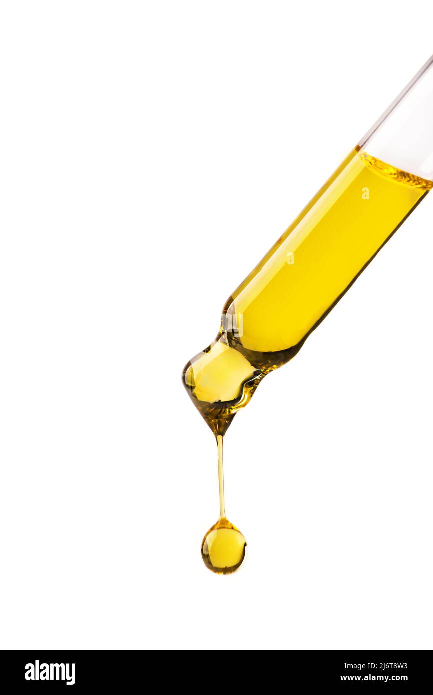 Dropper with cosmetic oil drop isolated on white background. Abstract ...