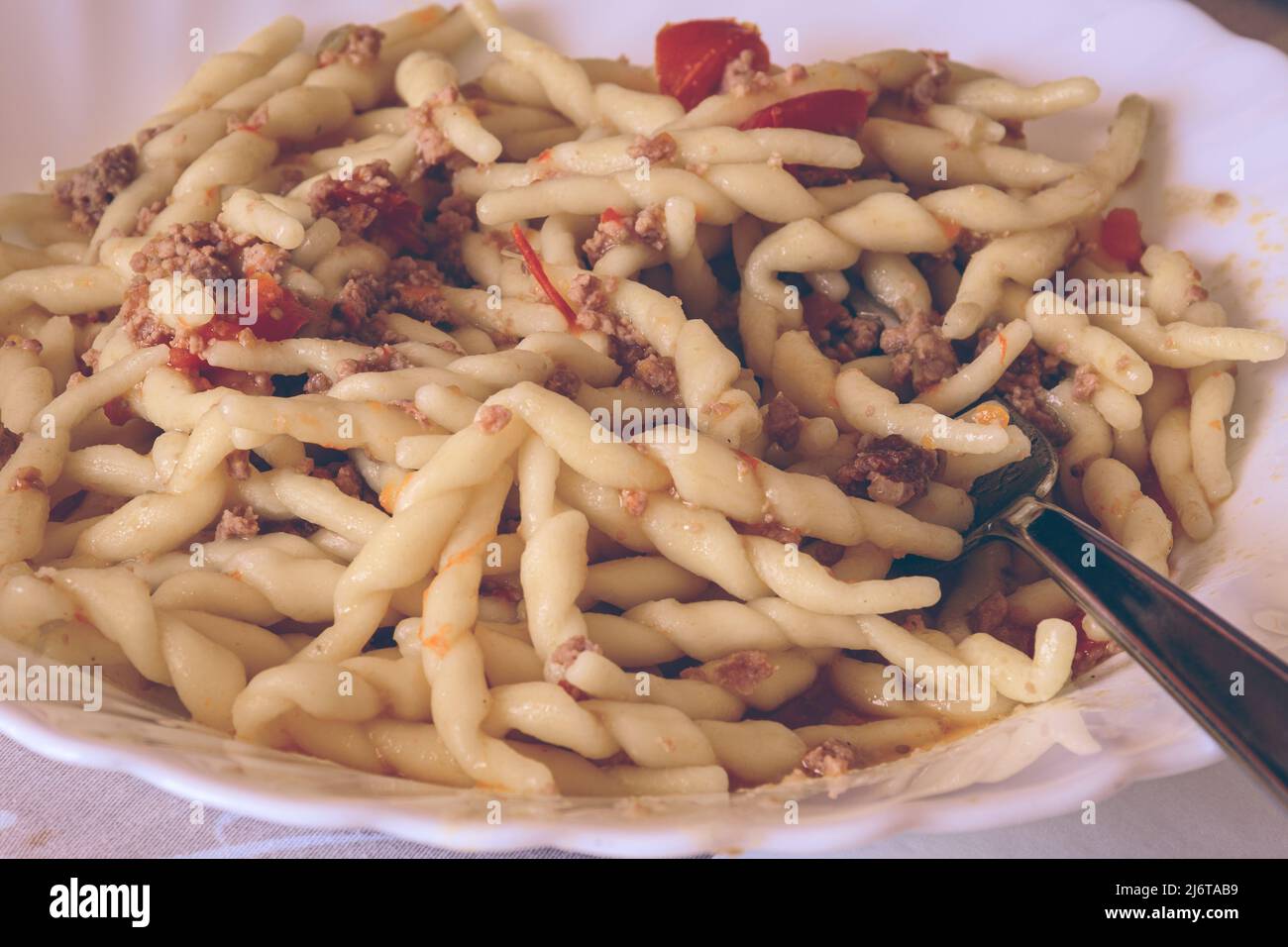 Italian Trofie Pasta With Meat And Tomatoes Stock Photo - Alamy