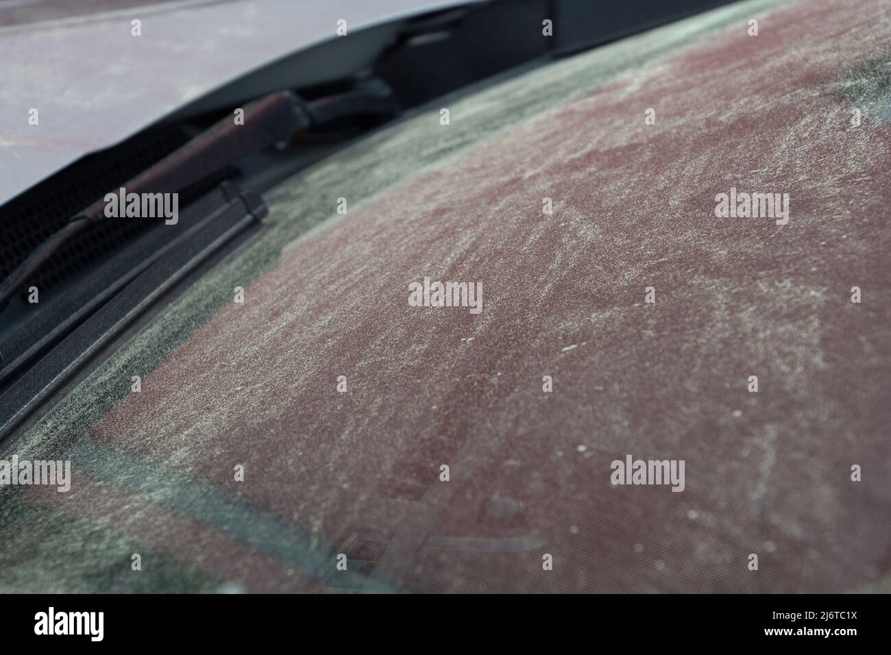 car window with wipers covered with sahara dust in germany at spring or ...