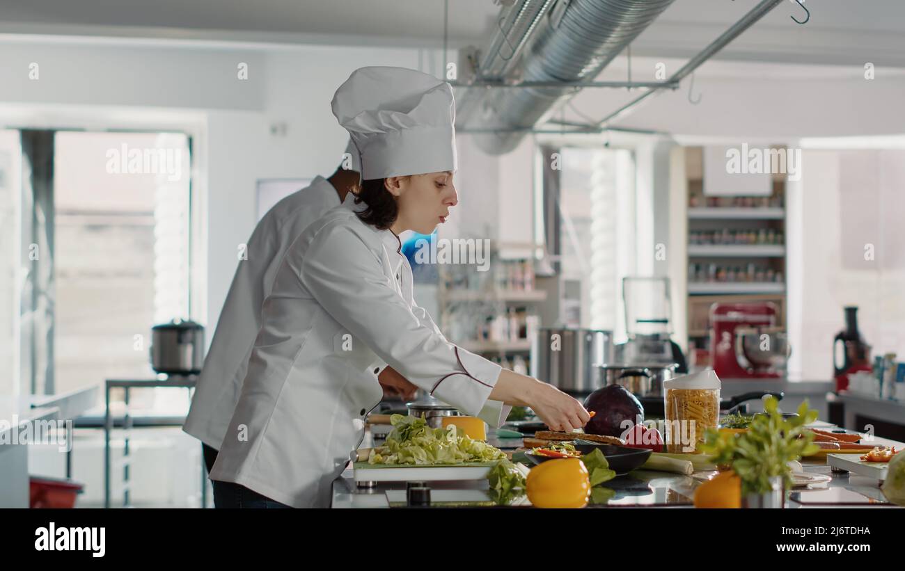 Woman cooking authentic professional cuisine hi-res stock photography ...