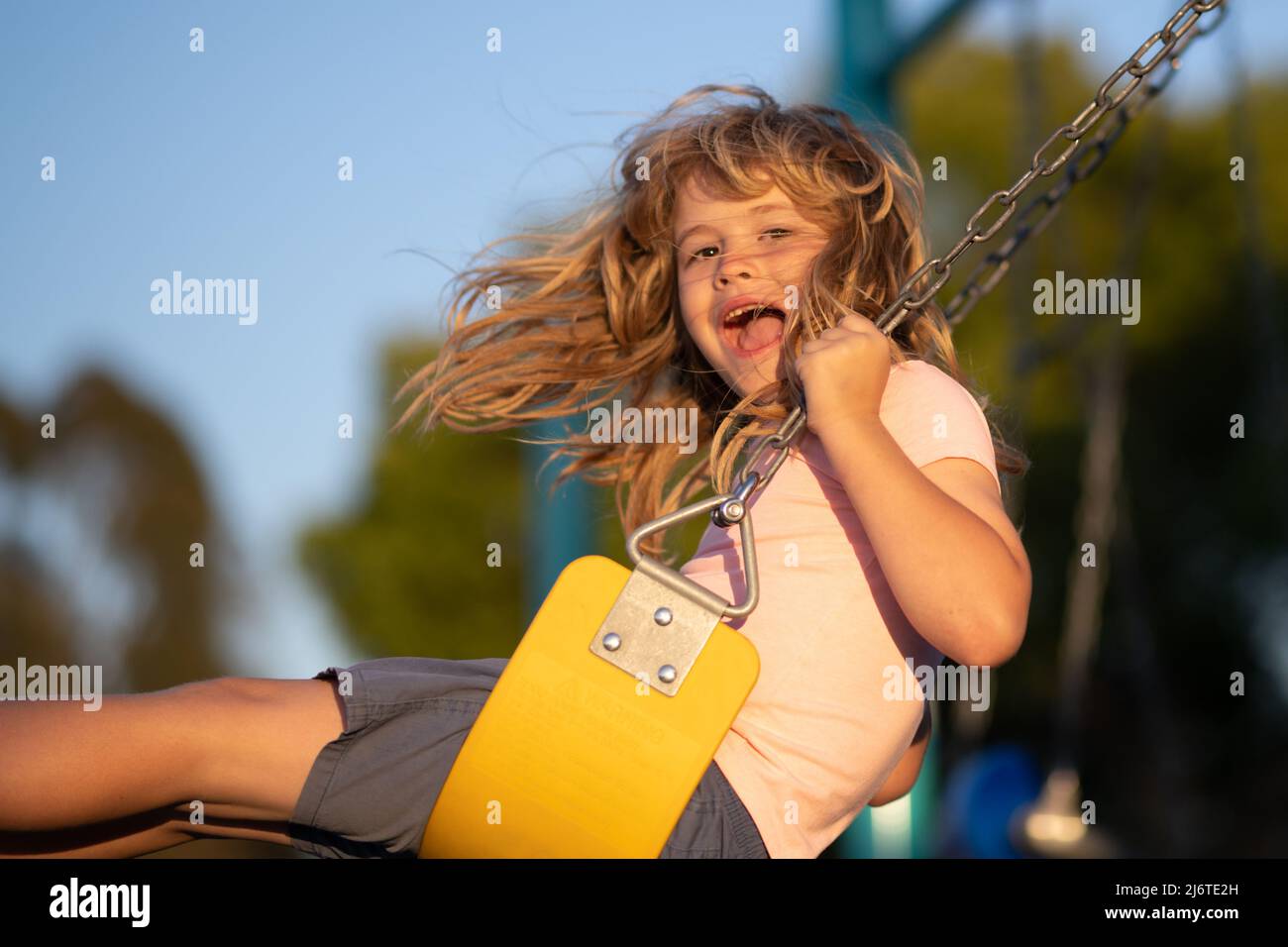 Emotional portrait of a child in the playground. Outdoor kids activity ...