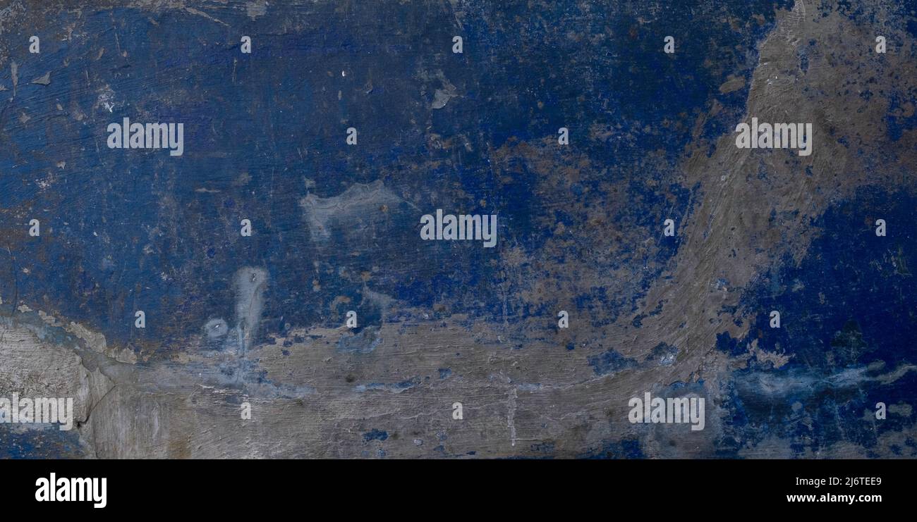 Distressed royal blue and gray concrete wall chipped and scratched ...