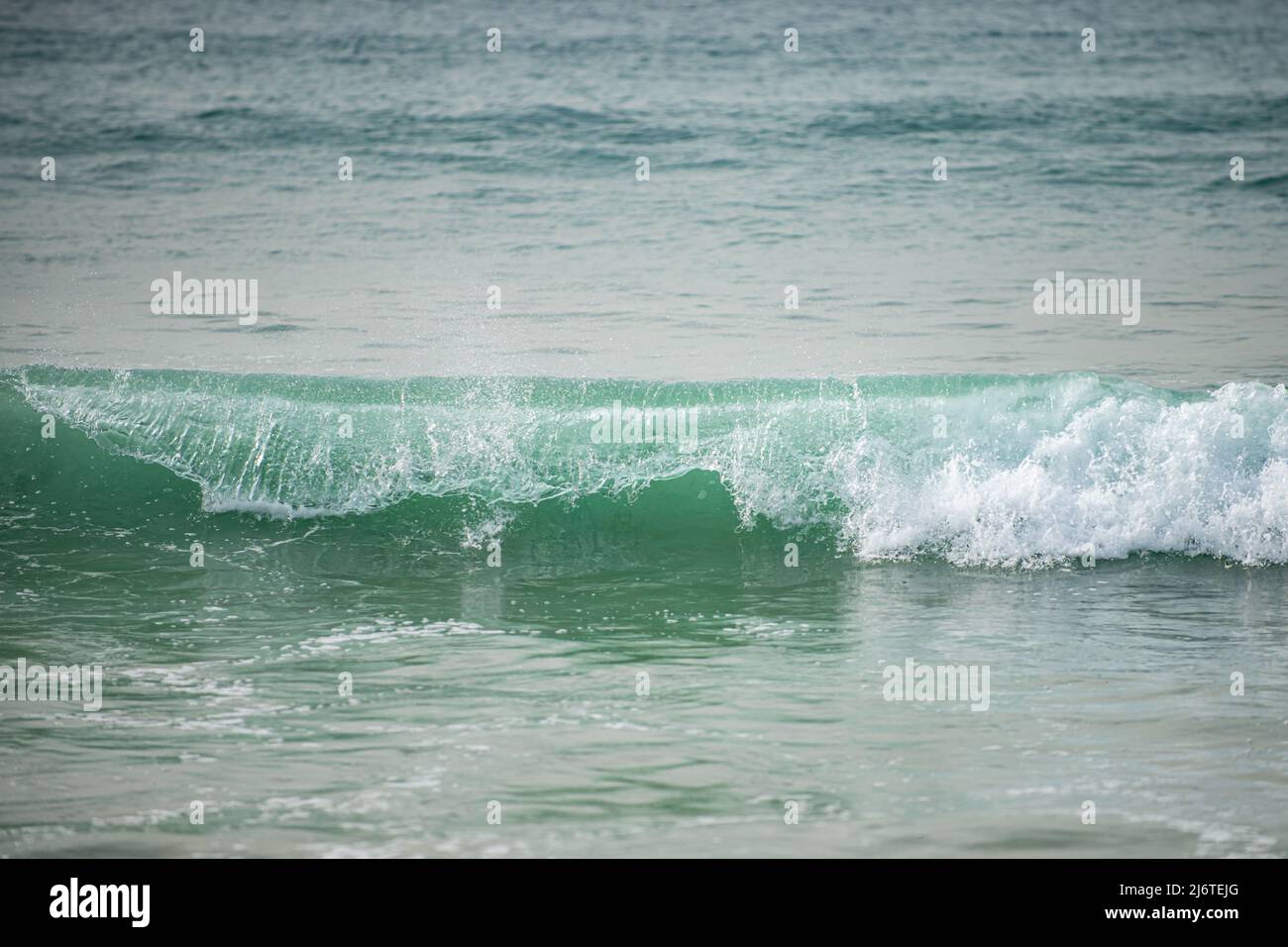 Summer beach, ocean waves on a tropical sea with deep blue wawes. Calm ...