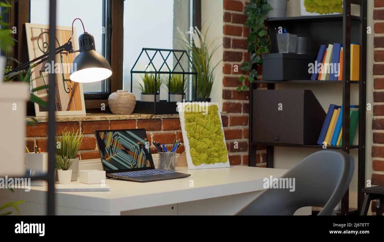 No people at empty desk with laptop computer in apartment, to use ...