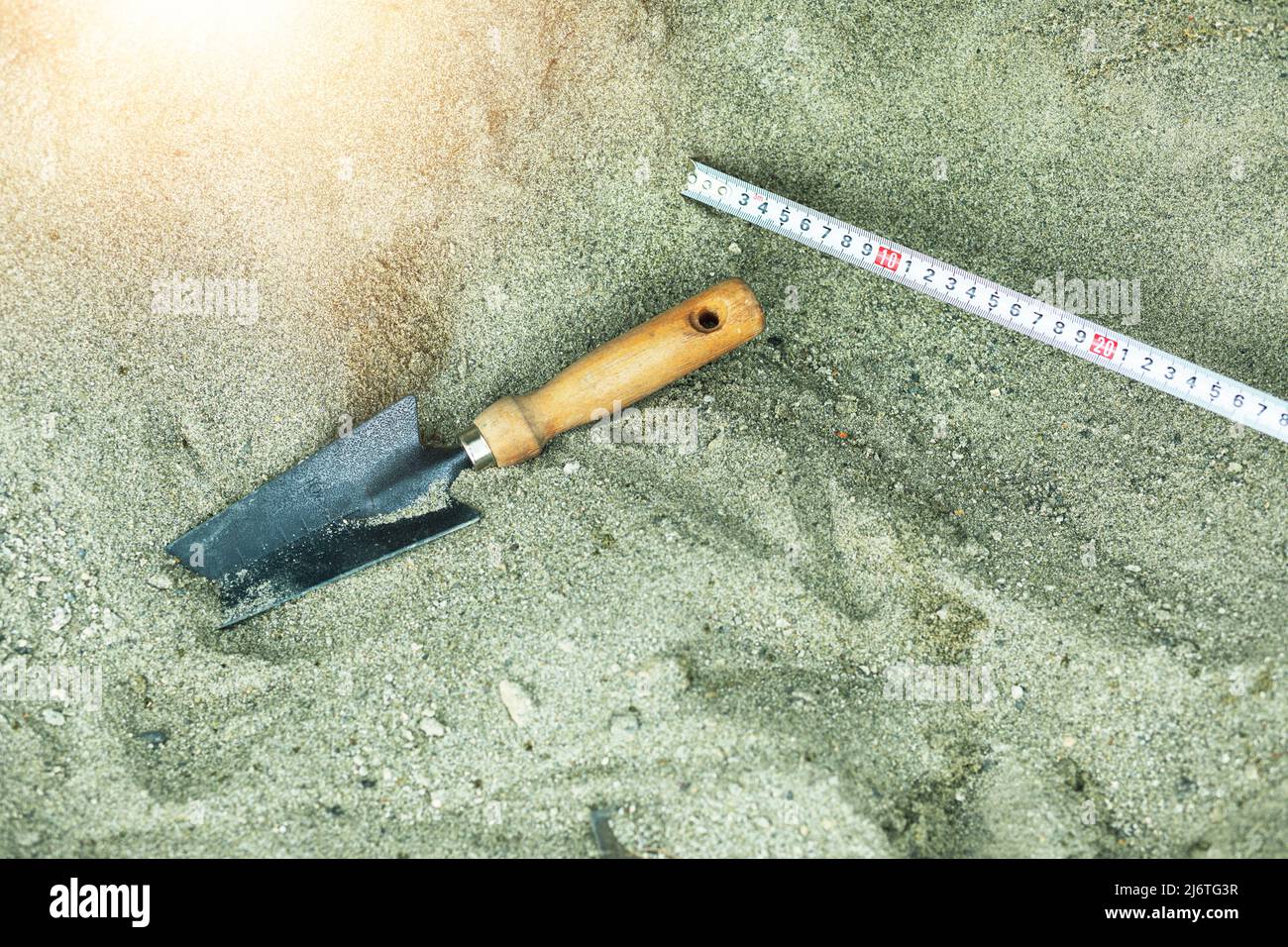 Shovel in the sand.Skeleton and archaeological tools.Digging for ...