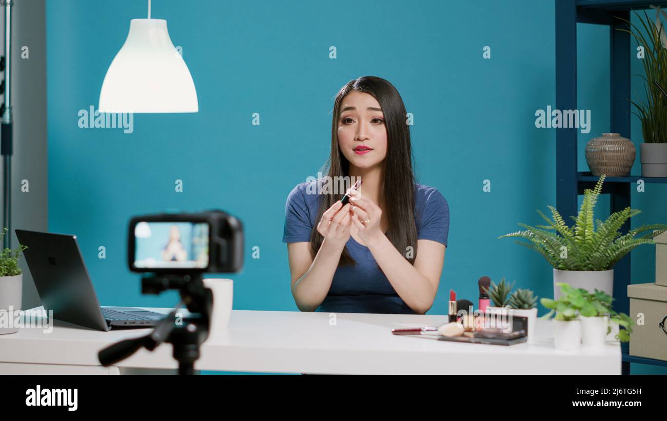 Content creator doing lipstick recommendation in studio, filming review ...