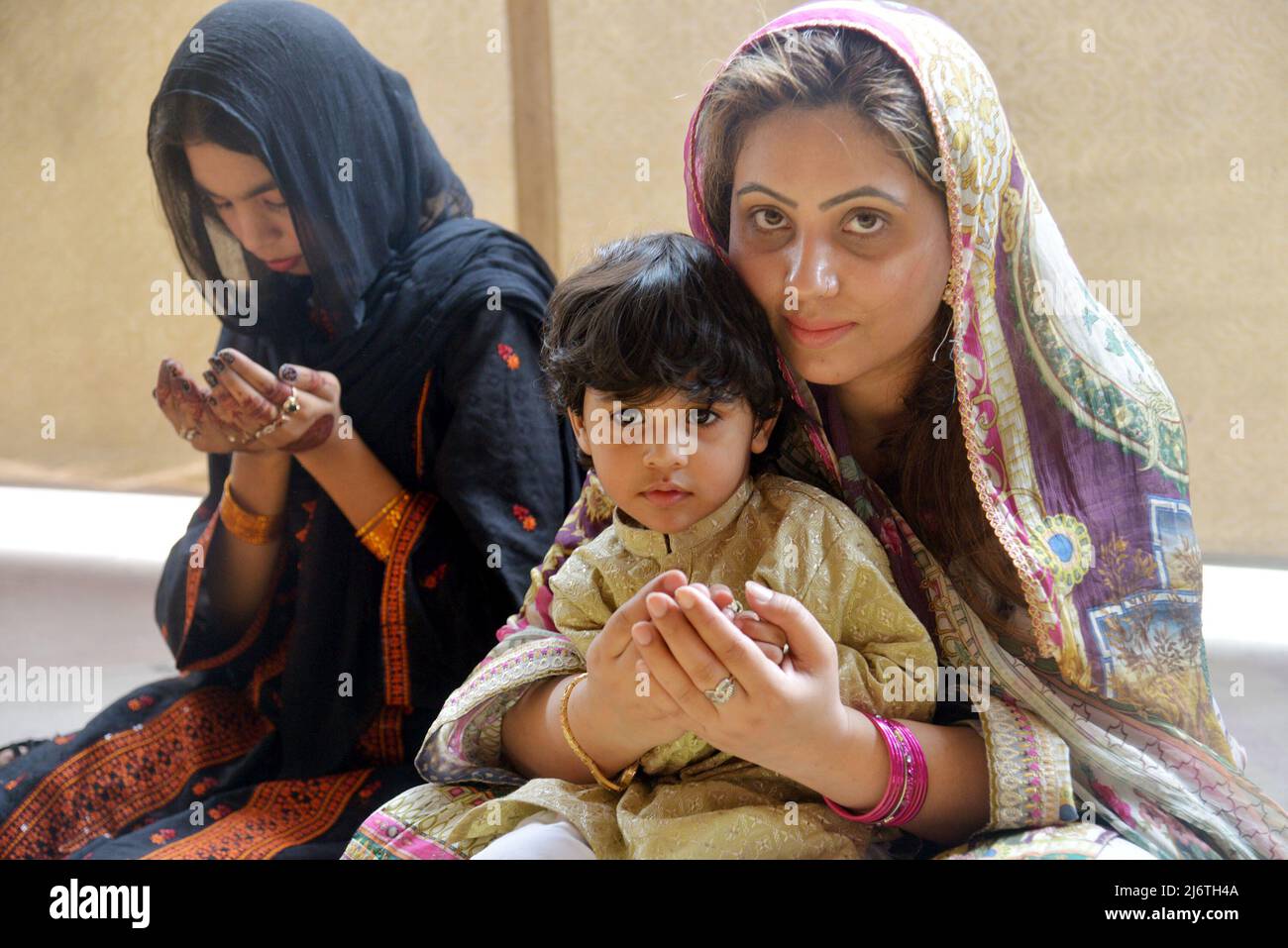 Pakistani devotees Muslim offering special morning prayers on the eve of Eid al-Fitr that marks ...