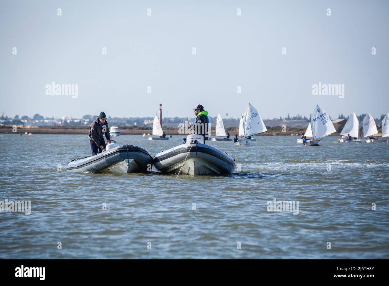 two people on a rubber dinghy are talking to each other on the Gilao ...