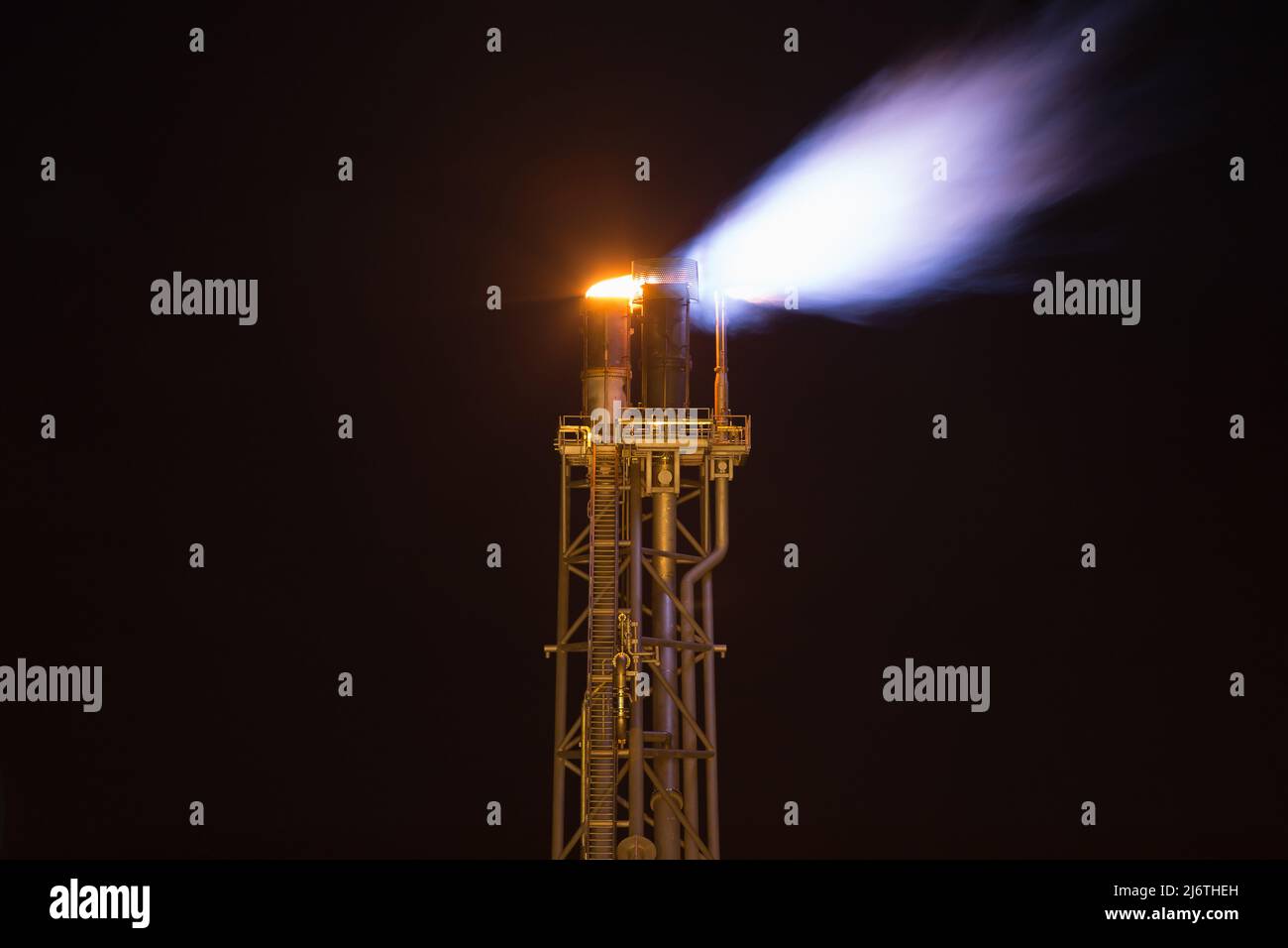 Flare stack and flare platform while burning gases from processing at ...