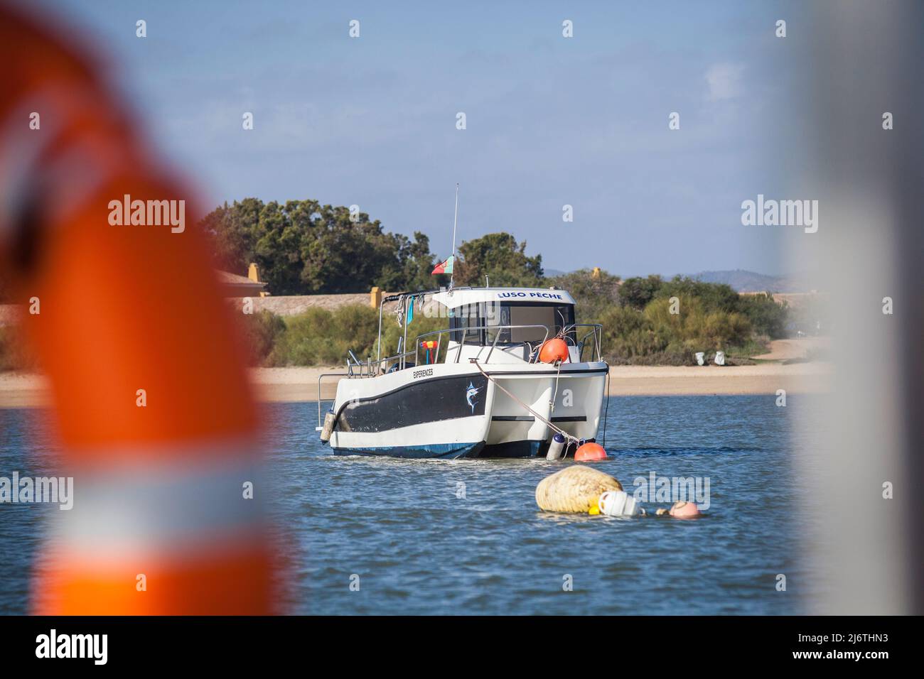 fisher boats on the river Gilao at the Ria Farmosa Nature Resort near ...