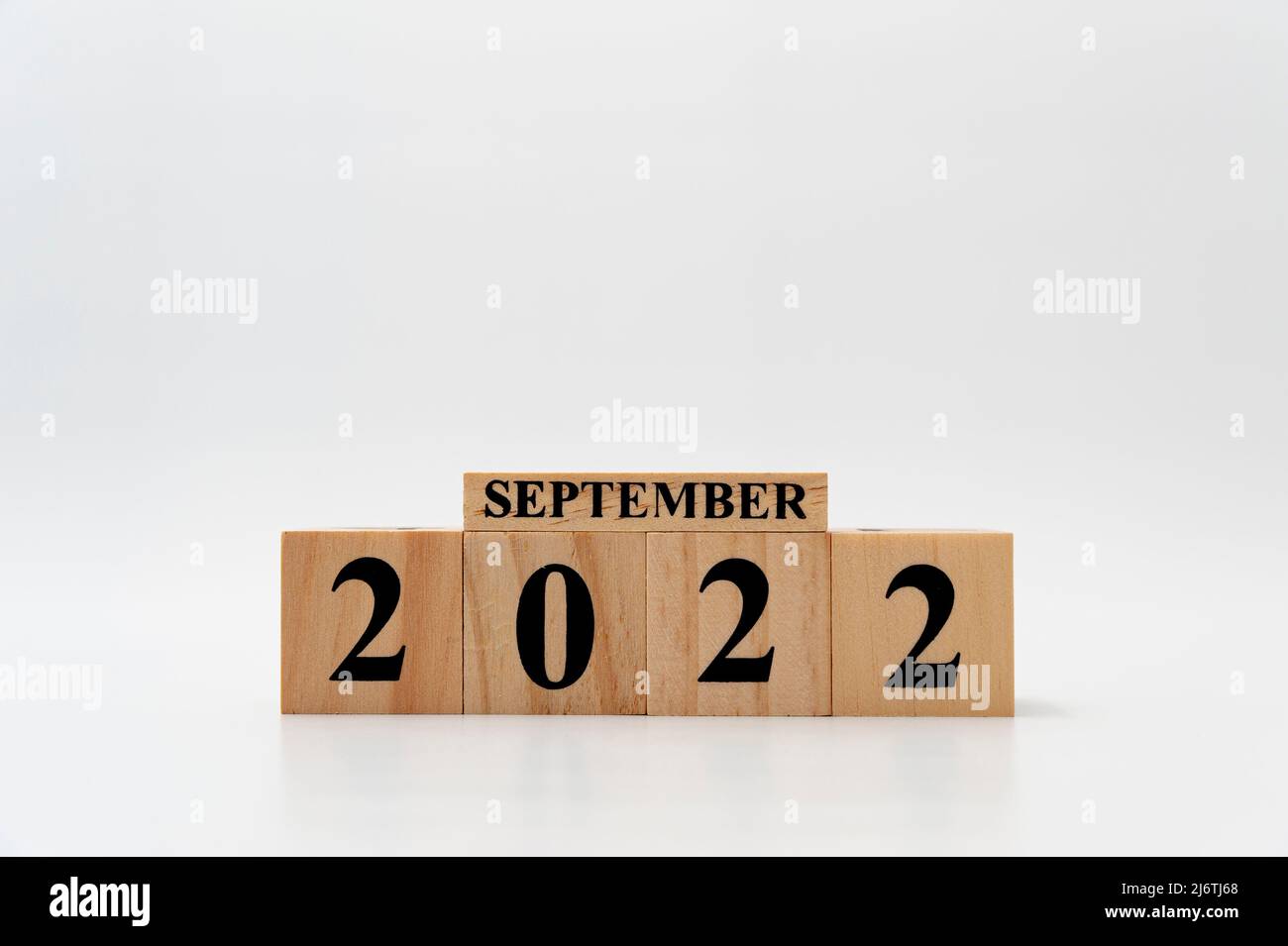 September 2022 written on wooden blocks isolated on white background ...
