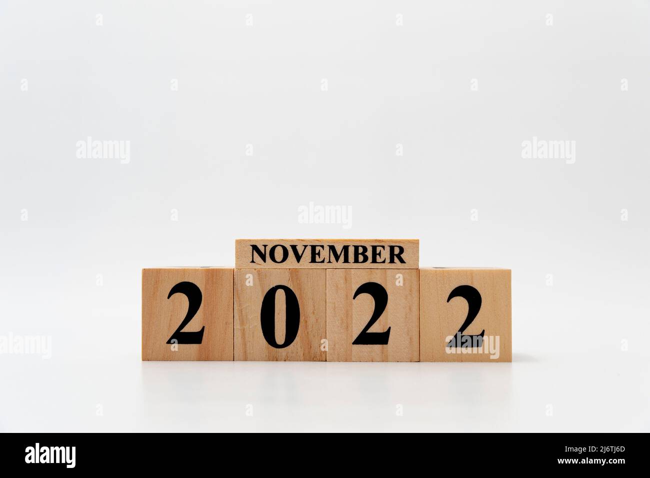 November 2022 written on wooden blocks isolated on white background ...
