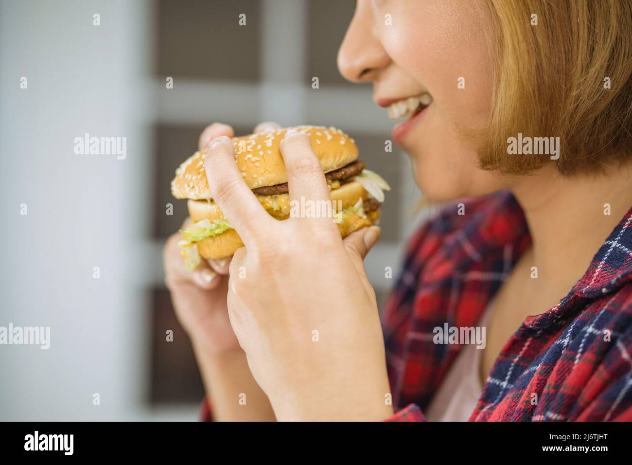 young pretty girl enjoy eating fast food burger unhealthy, american ...
