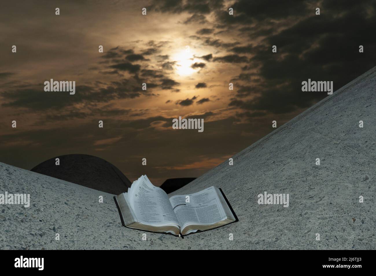 Open bible on top of a rock hi-res stock photography and images - Alamy
