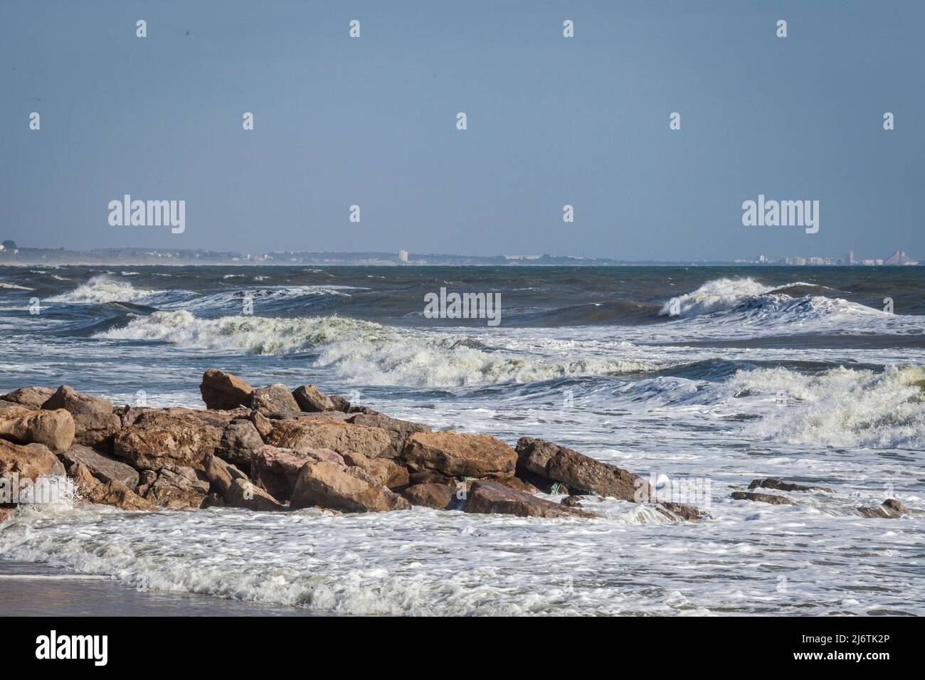 Rocks on the beach on a small island in the Ria Formosa Nature Reserve ...
