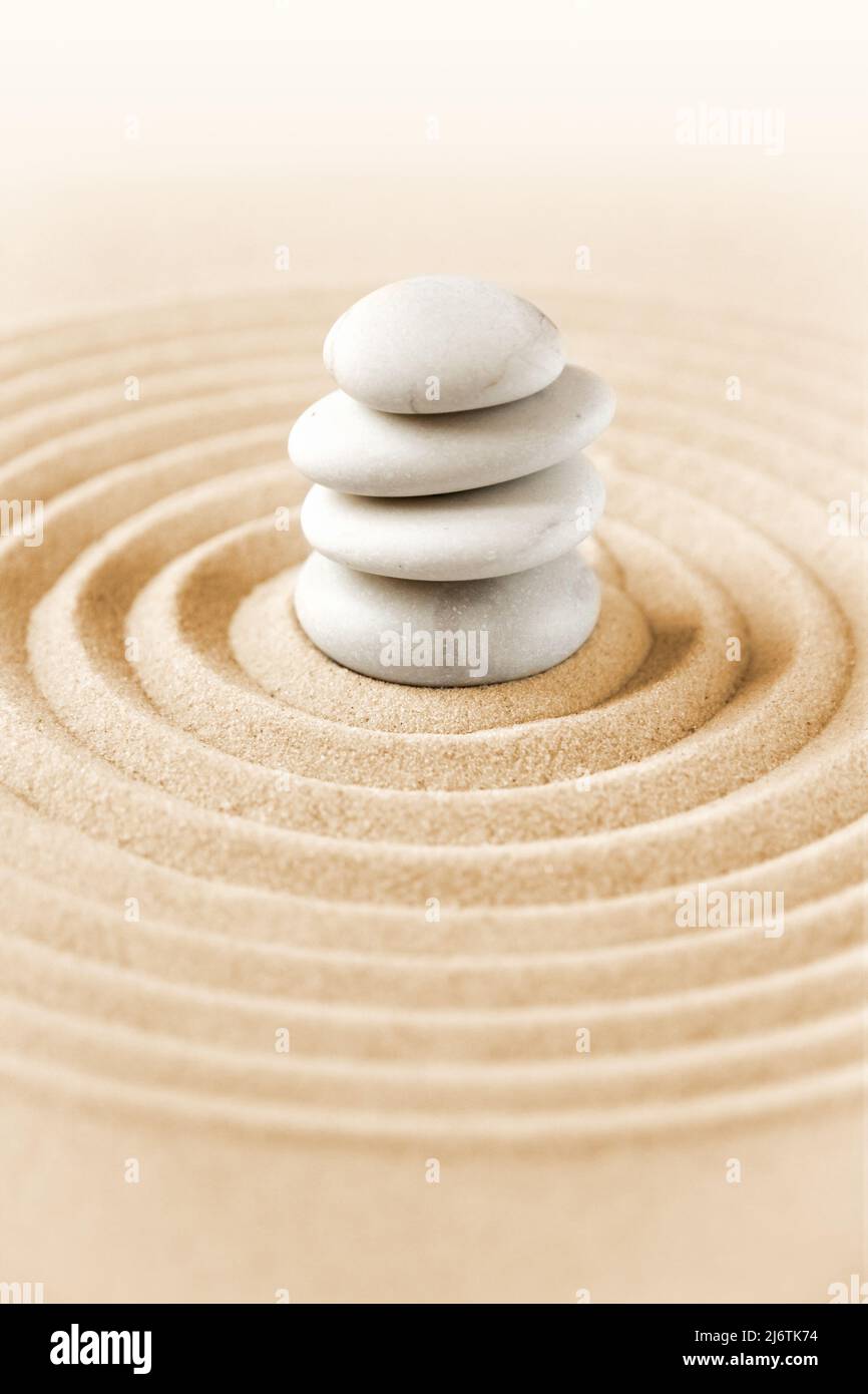 White stones pile in the sand. Zen japanese garden background scene ...