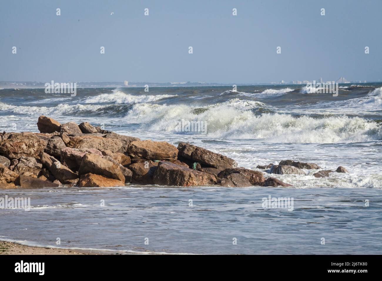Rocks on the beach on a small island in the Ria Formosa Nature Reserve ...