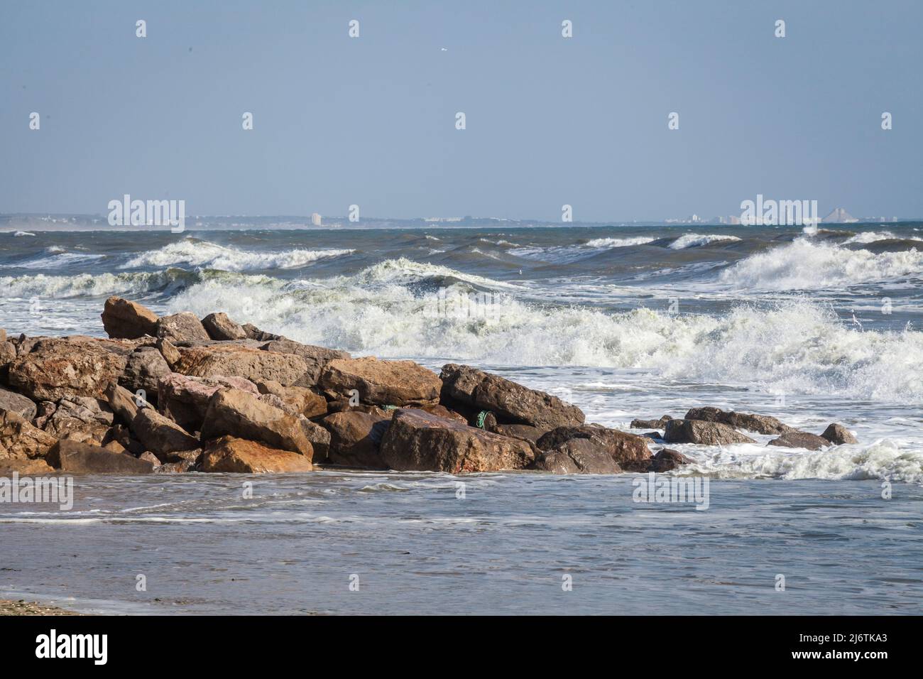 Rocks on the beach on a small island in the Ria Formosa Nature Reserve ...