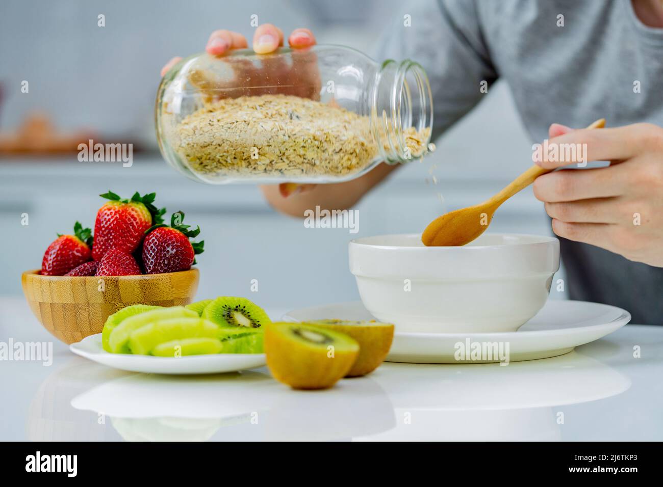 Asian man eating oatmeal for breakfast Stock Photo - Alamy