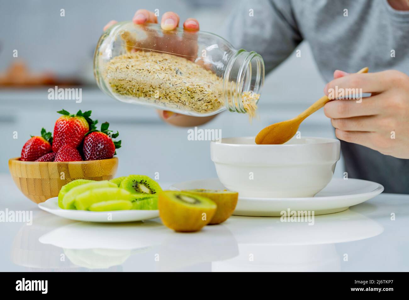 Asian man eating oatmeal for breakfast Stock Photo - Alamy