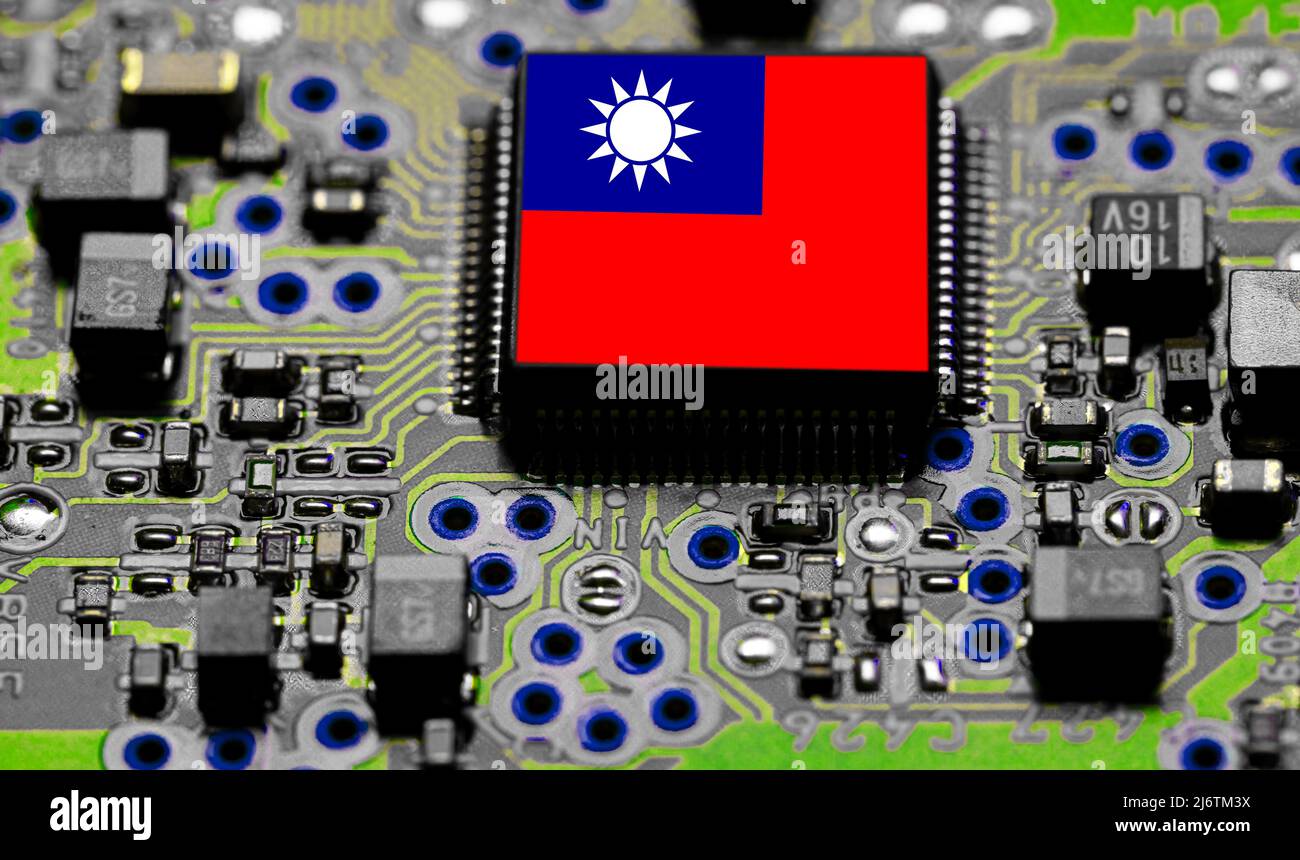 Taiwanese National Flag overlaid on PC micro chip on integrated circuit ...