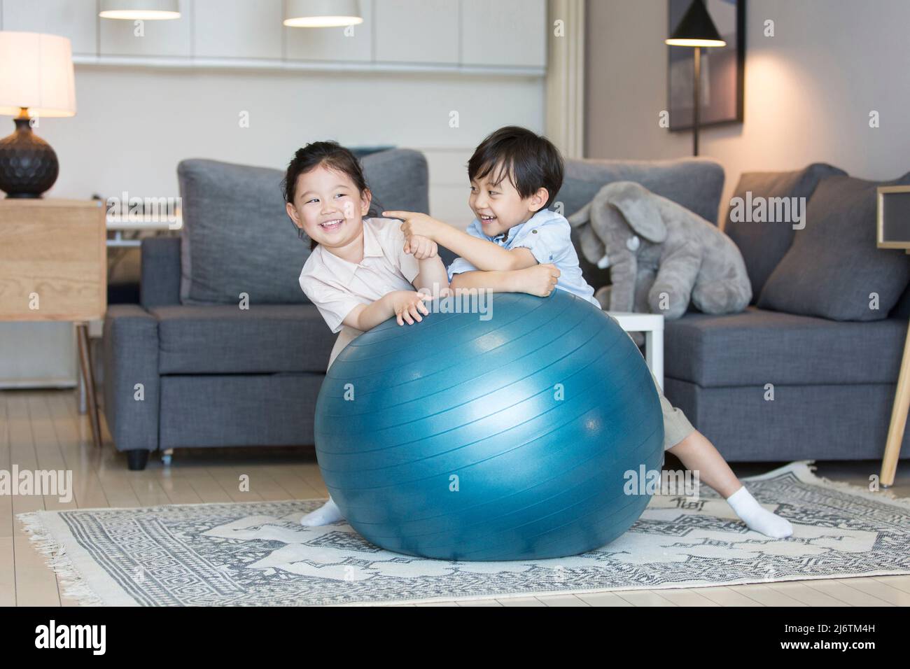 Boy touching legs hi-res stock photography and images - Alamy
