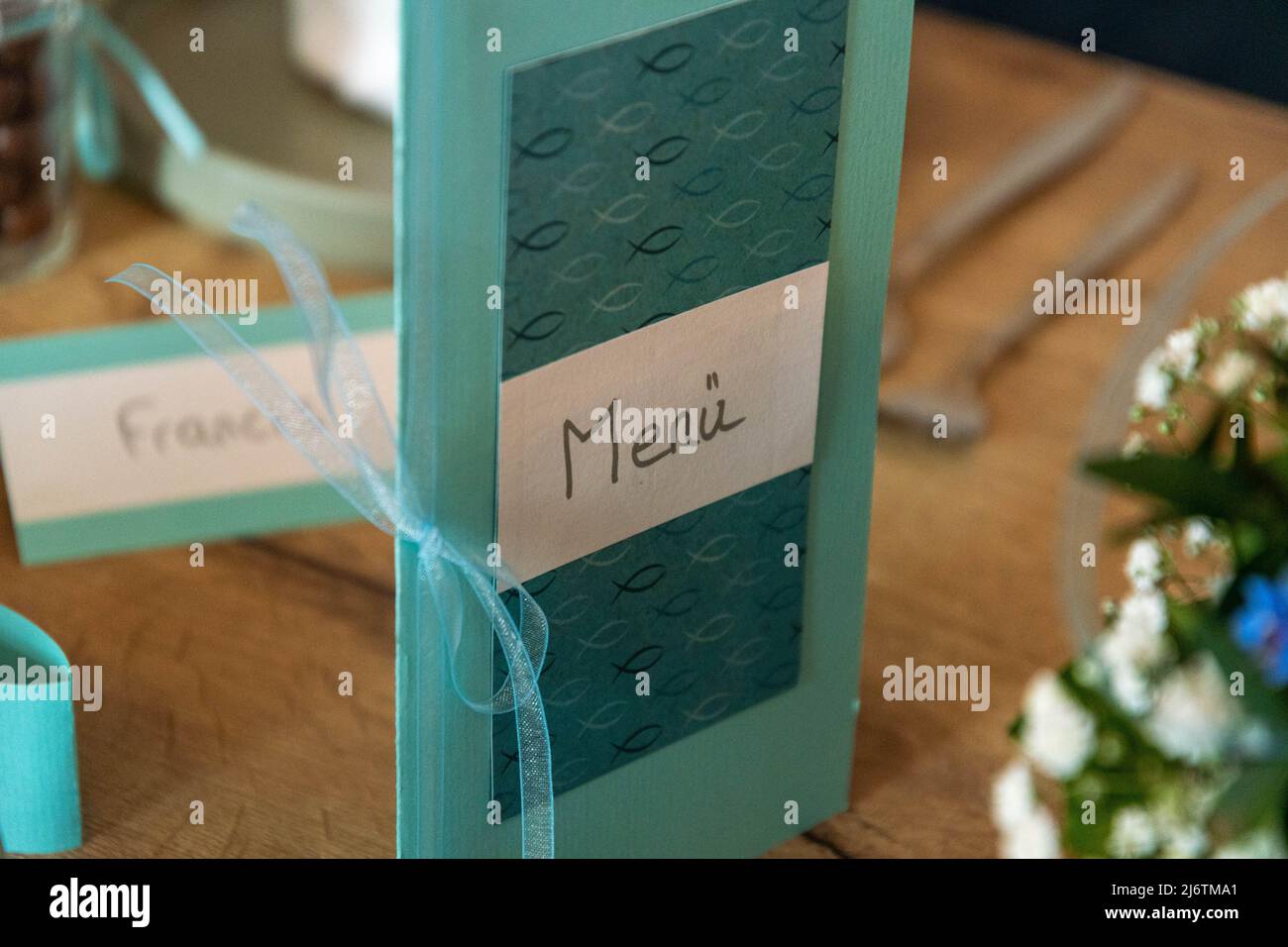 Turquoise Table Decoration with Menu Card Handwritten Stock Photo - Alamy