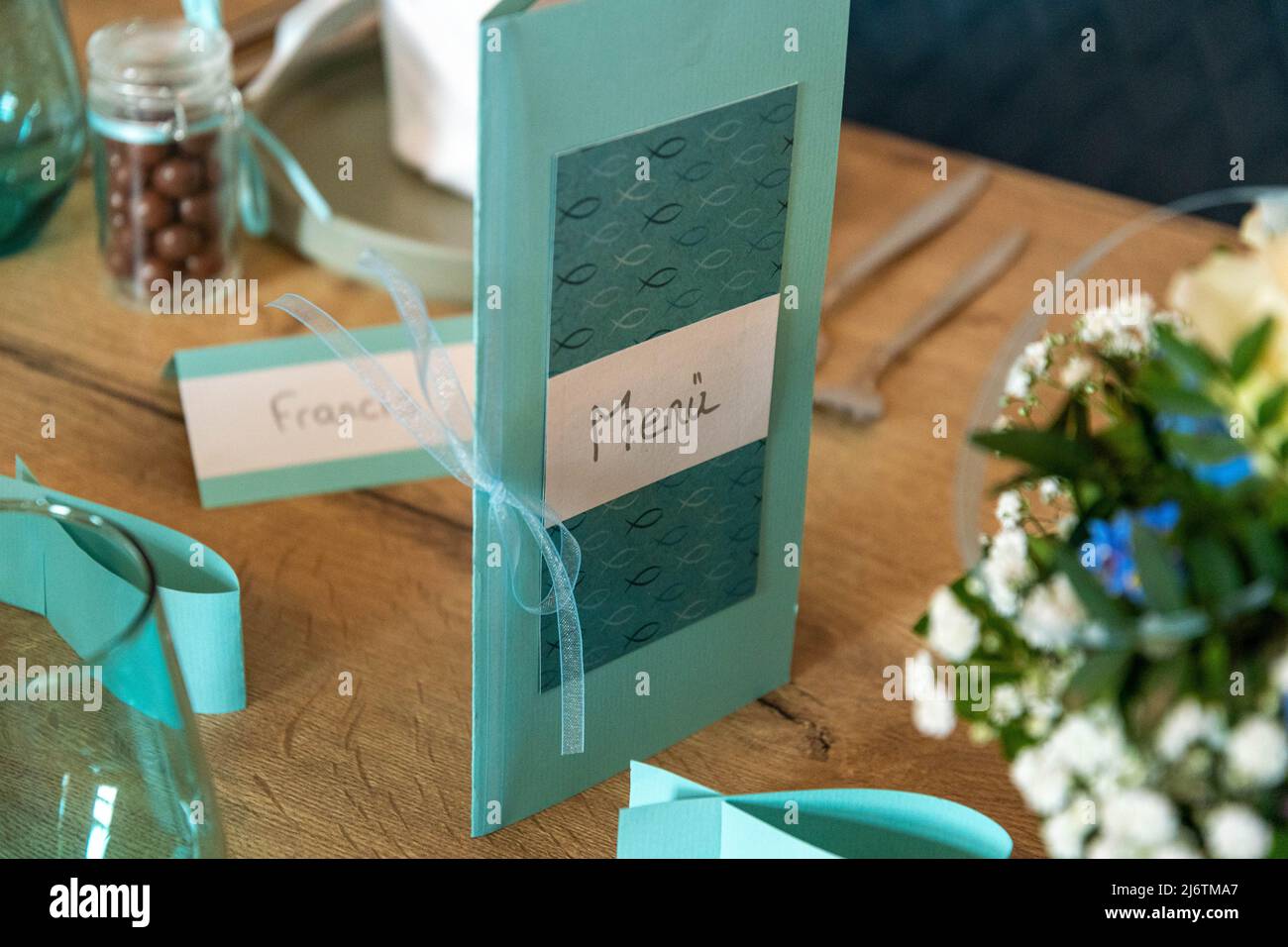 Turquoise Table Decoration with Menu Card Handwritten Stock Photo - Alamy