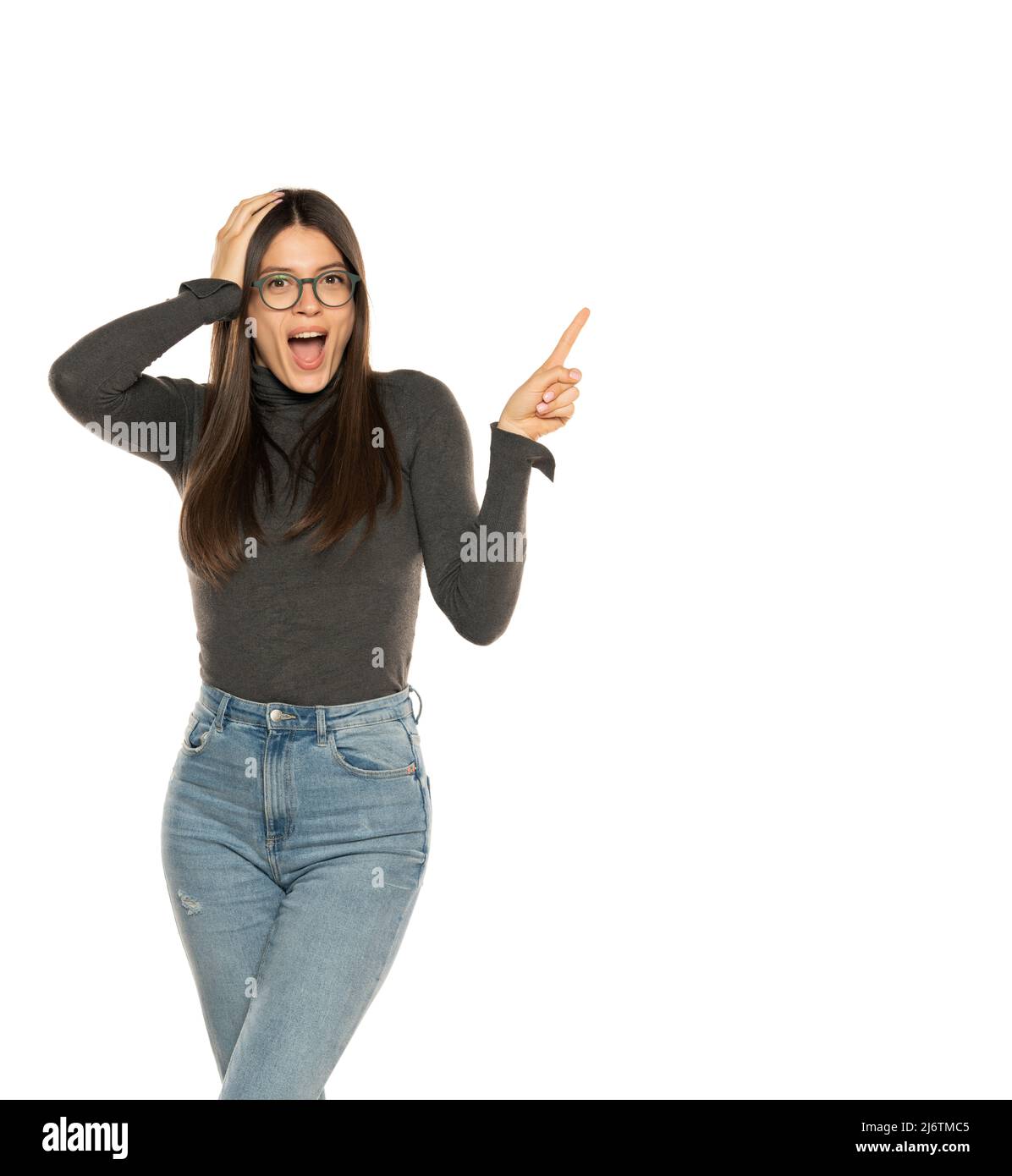 happy young and beutiful woman standing isolated over white wall ...