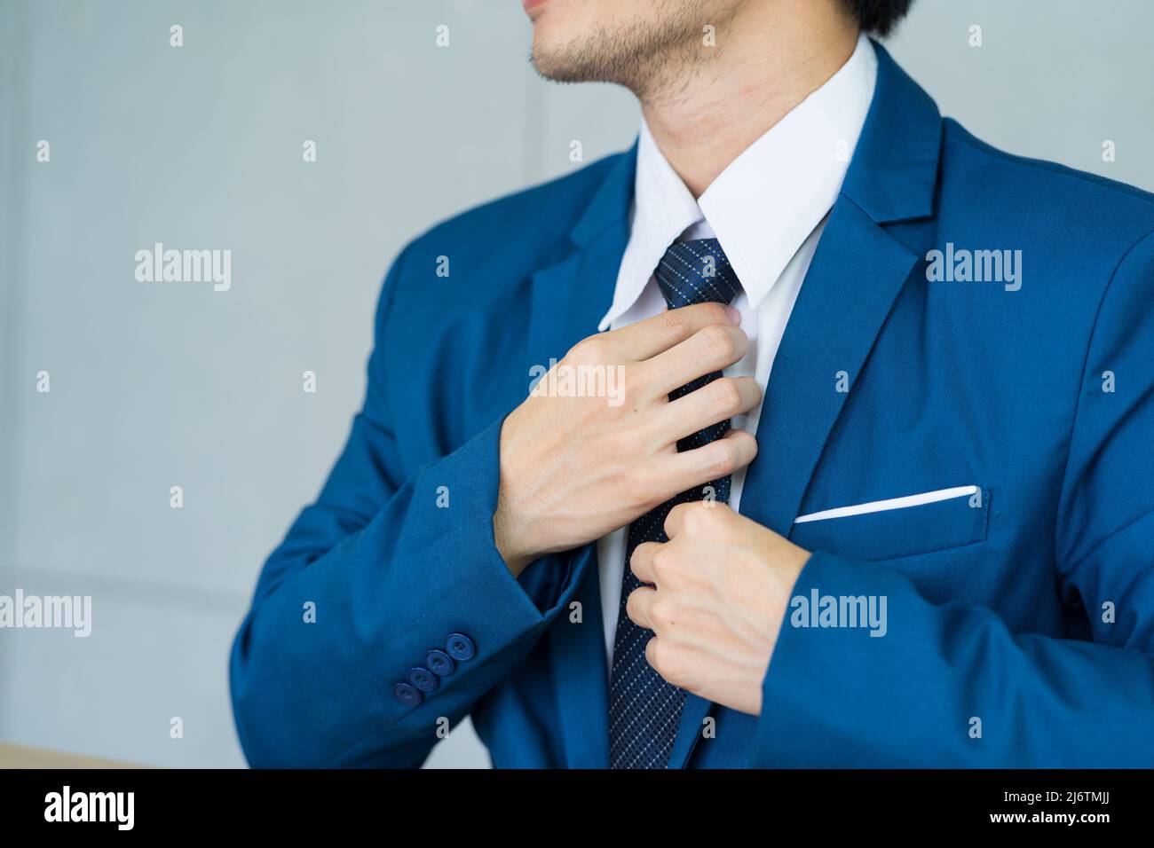 Adjusting necktie hi-res stock photography and images - Alamy