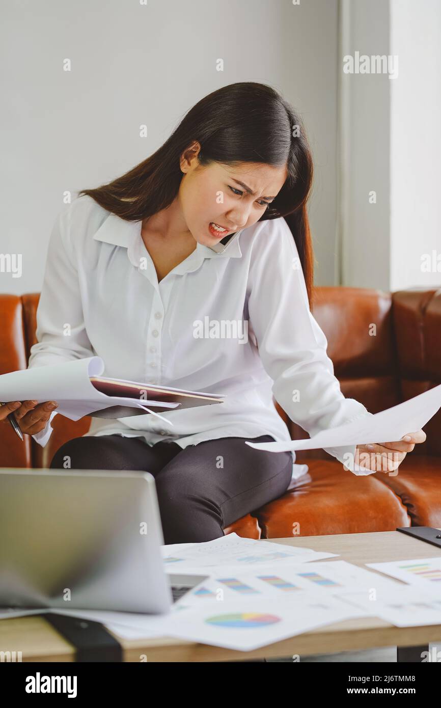 asian business woman busy with work Stock Photo - Alamy