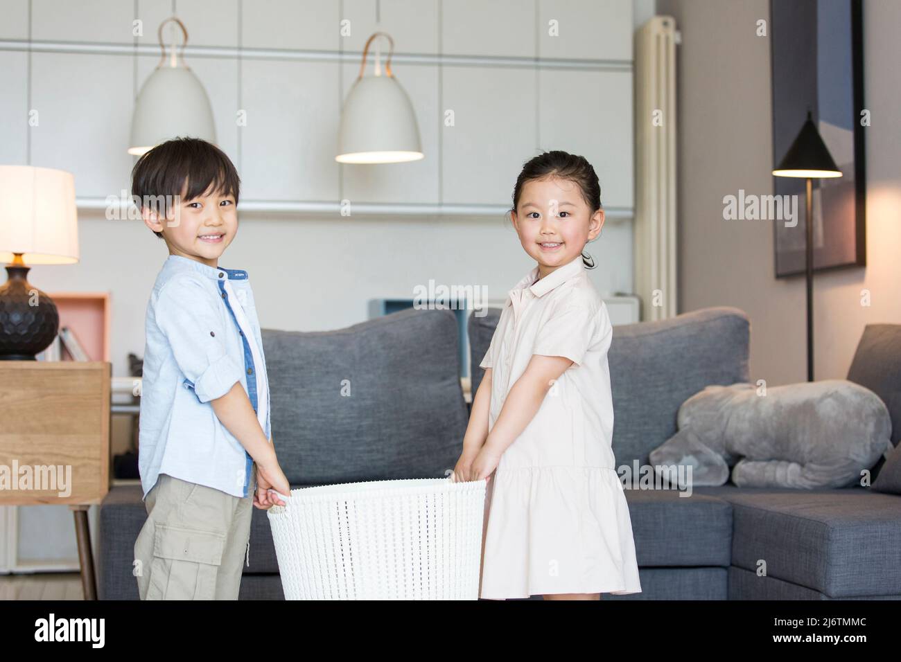 Siblings doing laundry together hi-res stock photography and images - Alamy
