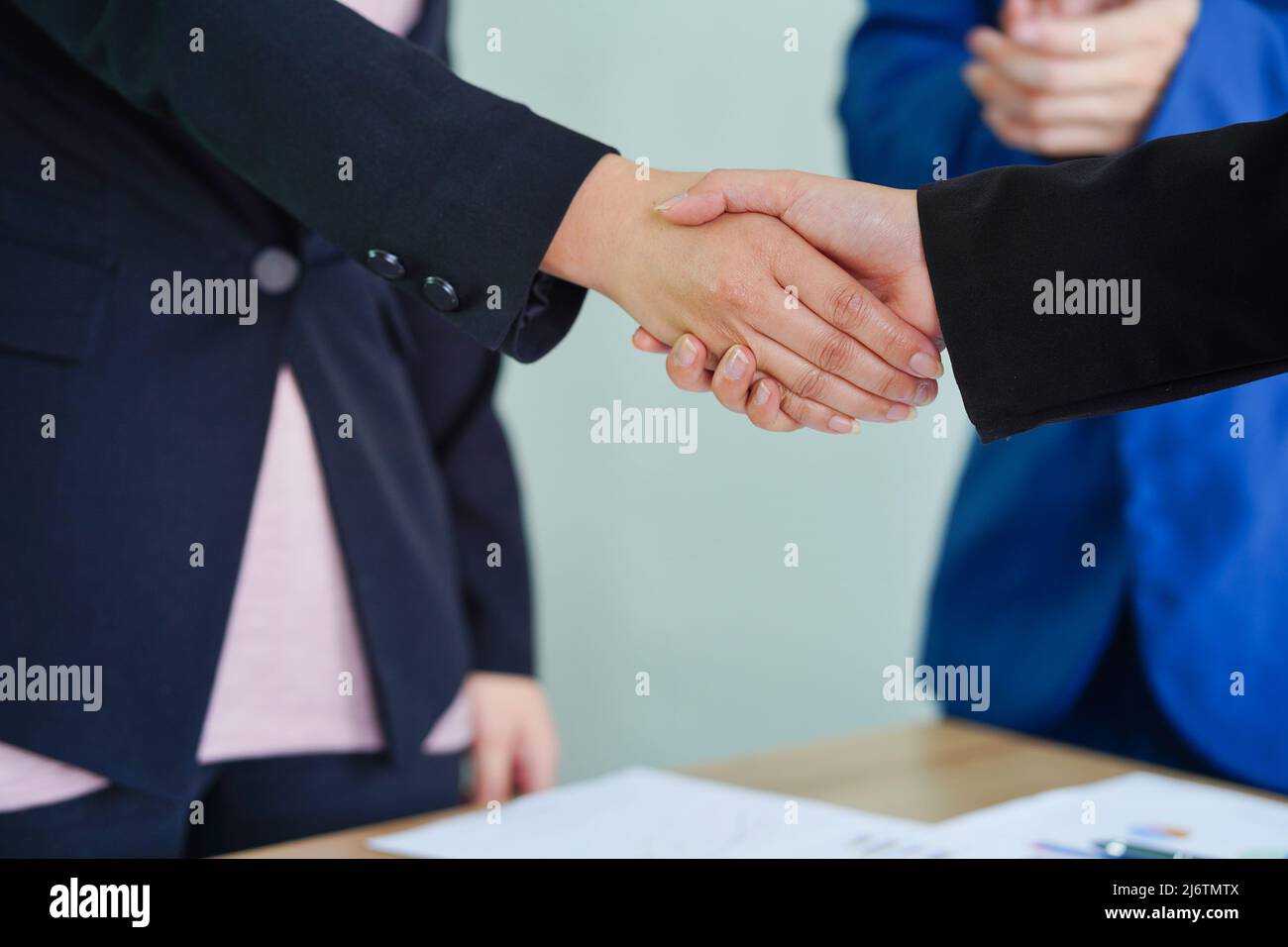 Handshake partners team meeting shaking hands together, Business ...