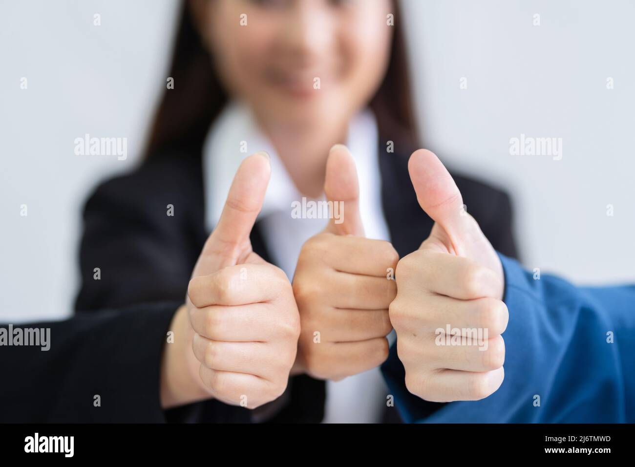 Businessman thumbs up hand shake hi-res stock photography and images ...