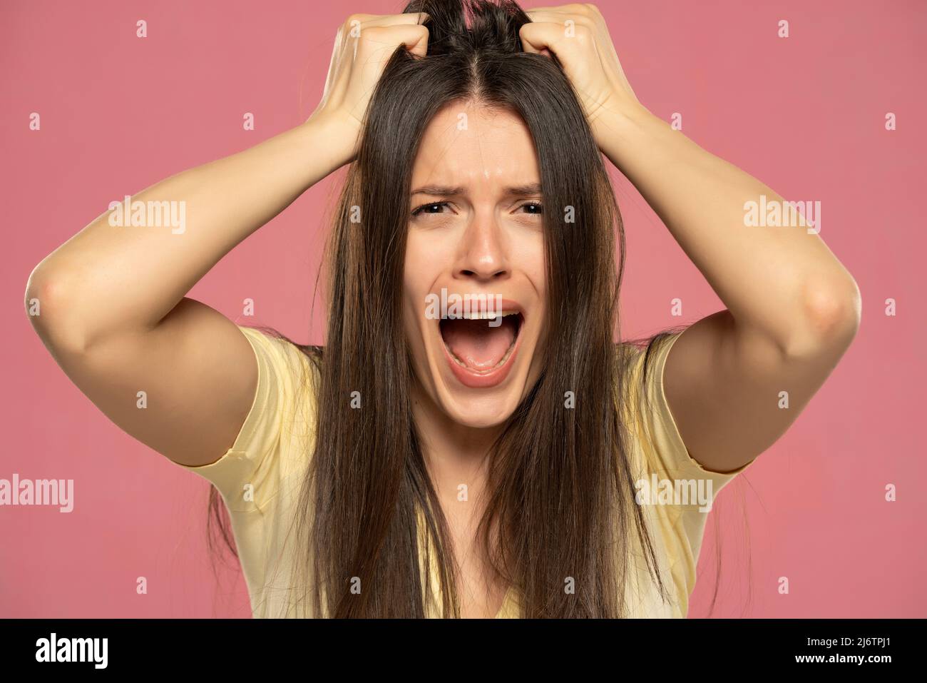 Closeup portrait stressed frustrated woman screaming isolated on pink ...