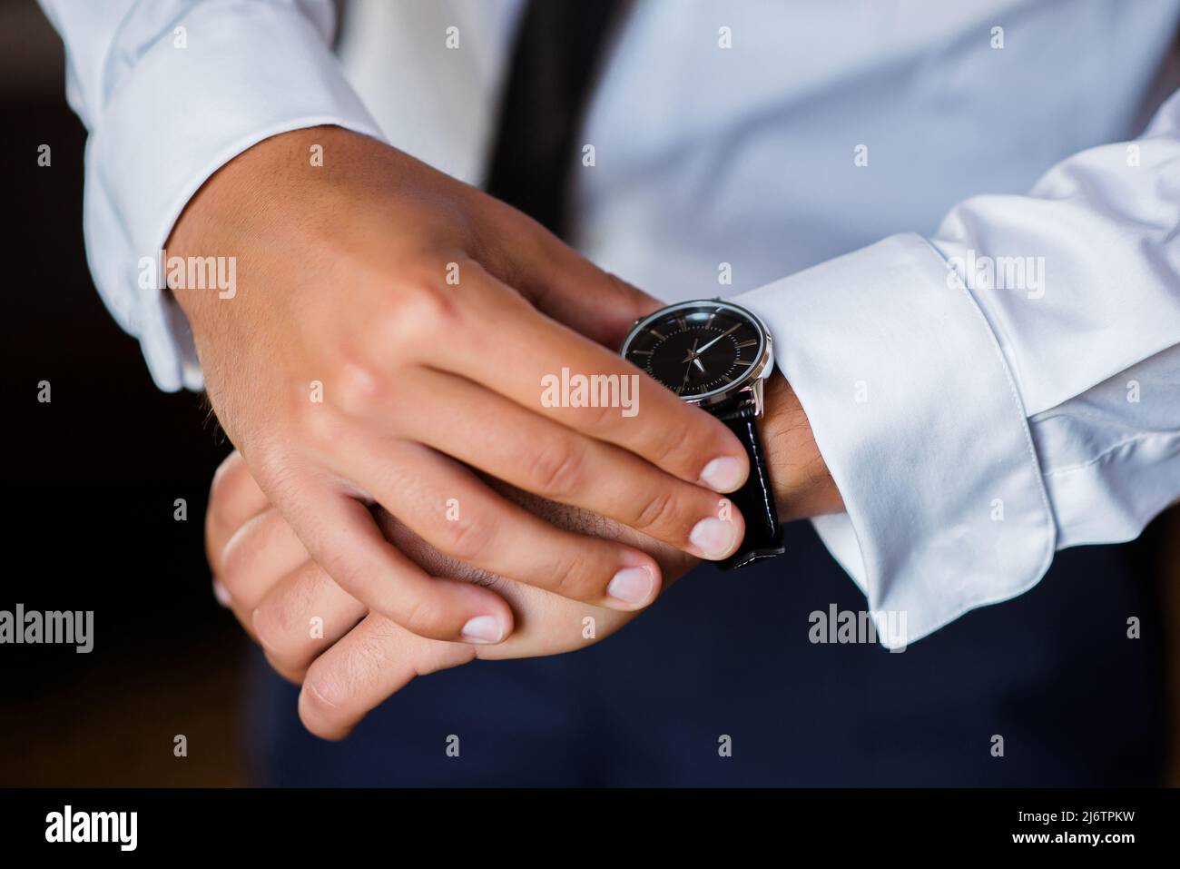 Businessman pointing at hand watch. timing concept Stock Photo - Alamy