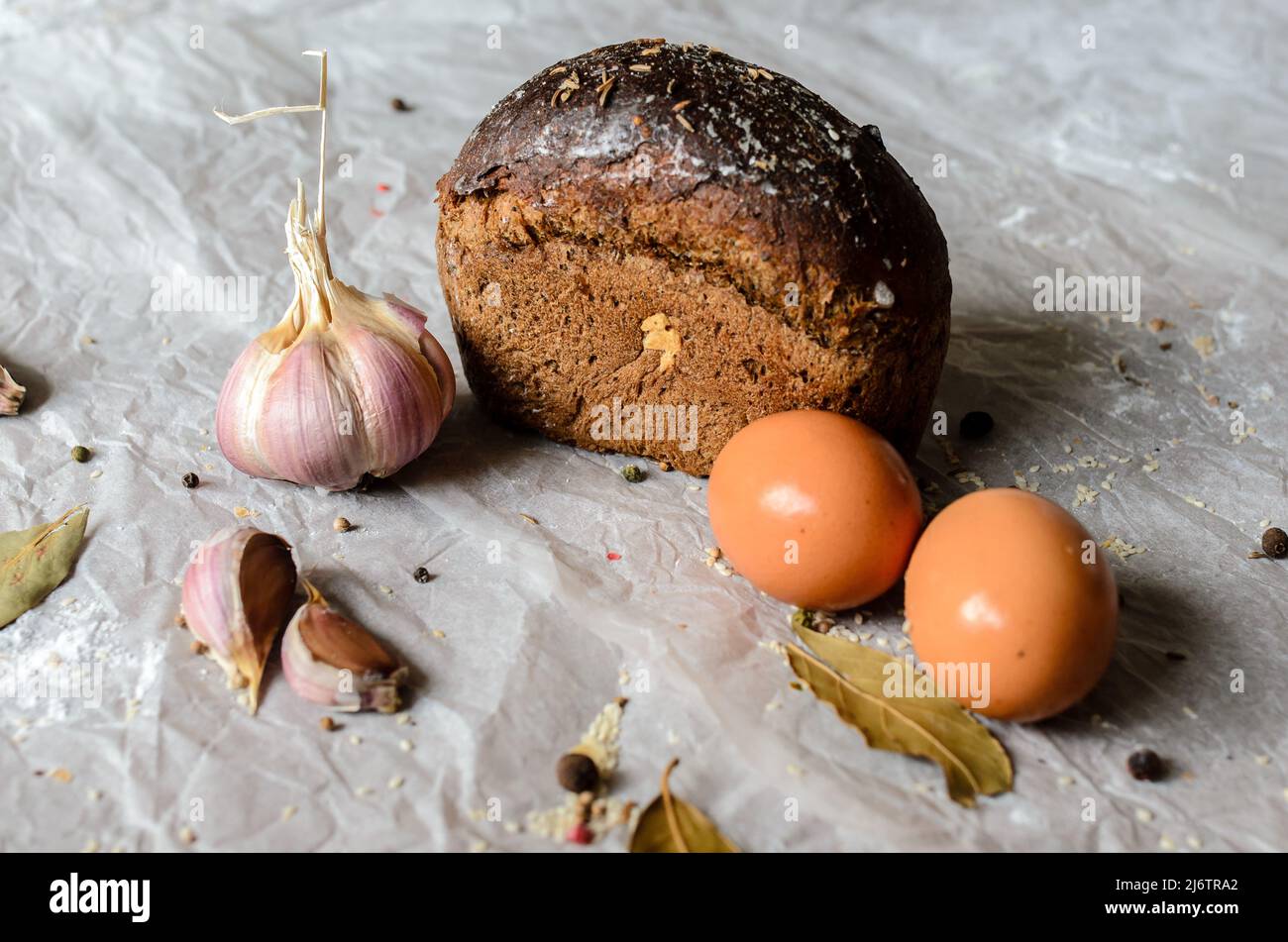 Still life of bread, eggs, garlic and spices Stock Photo - Alamy