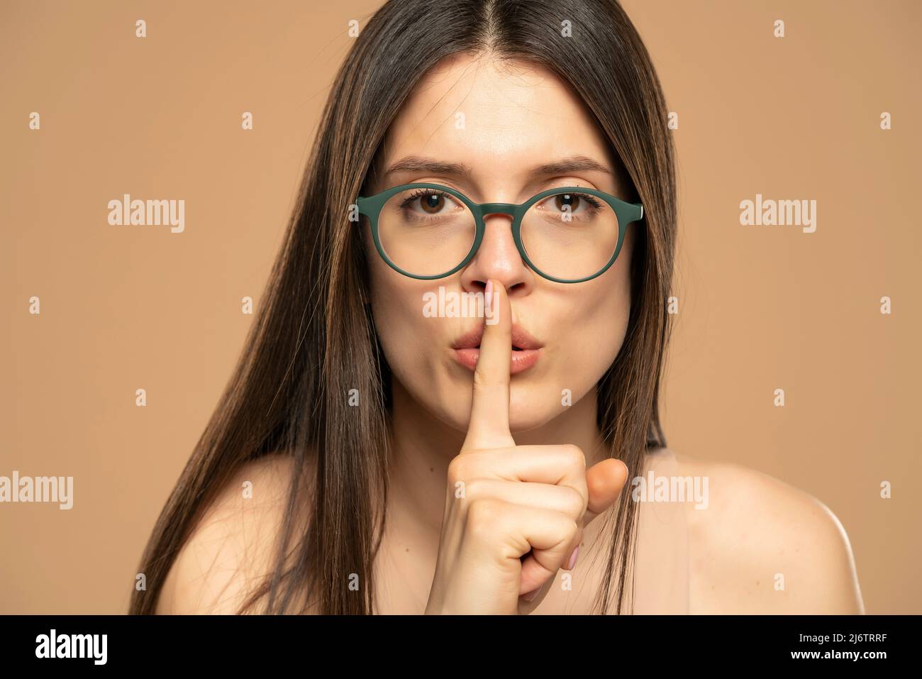 Covering lips hi-res stock photography and images - Alamy