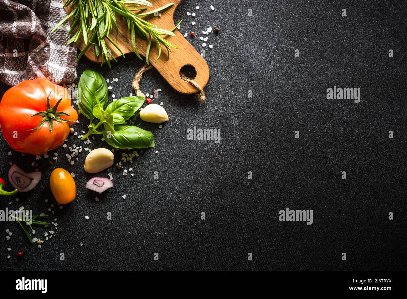 Food cooking background on black stone table Stock Photo - Alamy