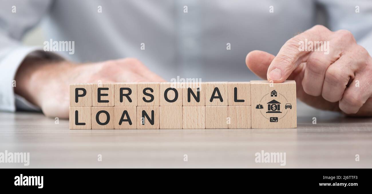 Wooden blocks with symbol of personal loan concept Stock Photo - Alamy