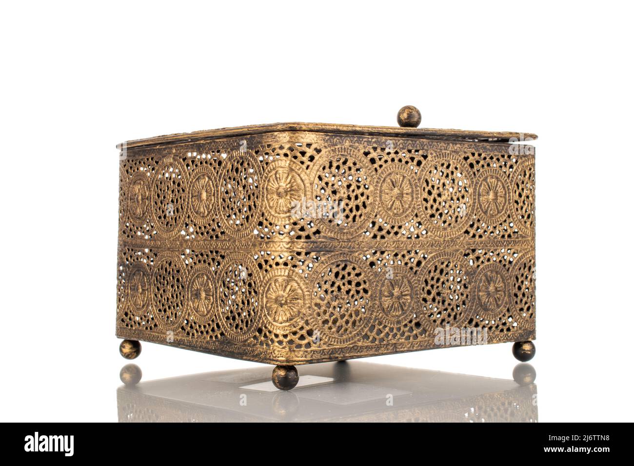 One handmade decorative metal box, close-up, isolated on a white ...