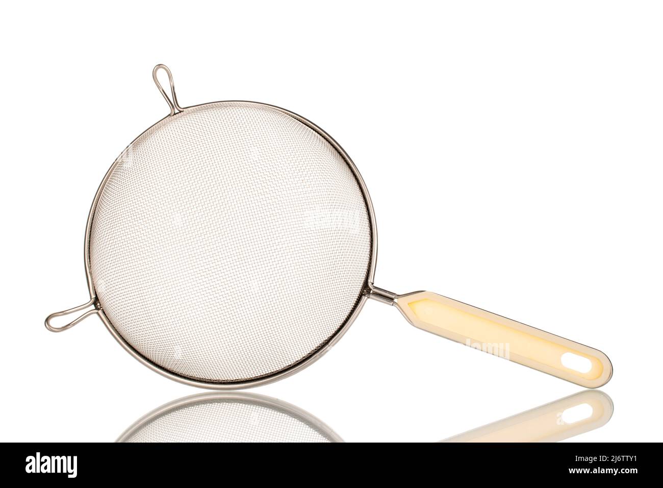 One metal sieve for the kitchen, close-up, isolated on a white ...