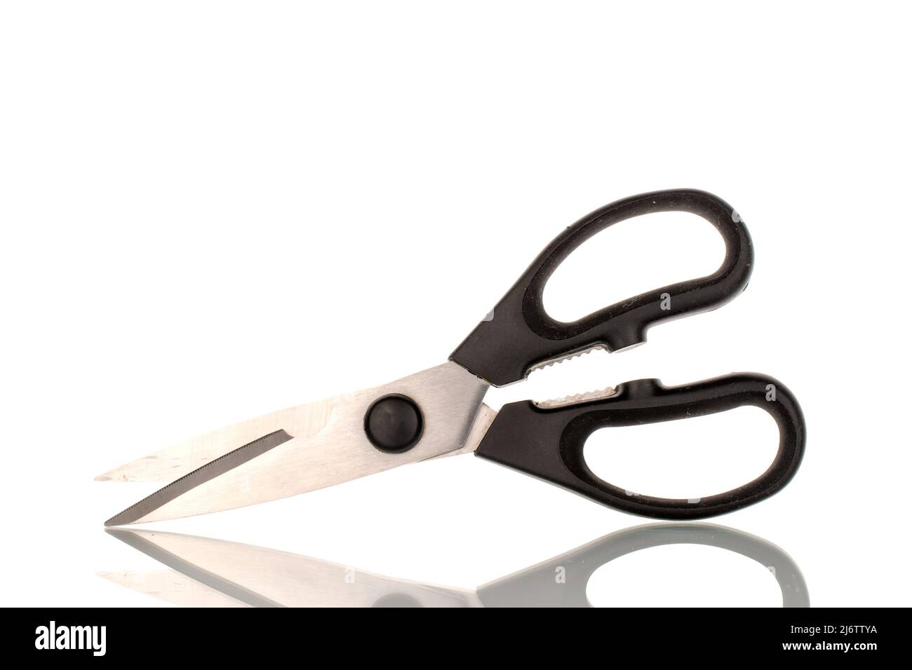 One metal scissors for the kitchen, close-up, isolated on a white ...