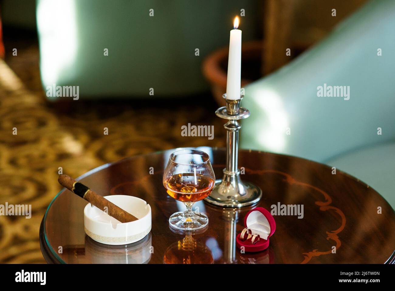 cognac and cigar lying on the table Stock Photo - Alamy