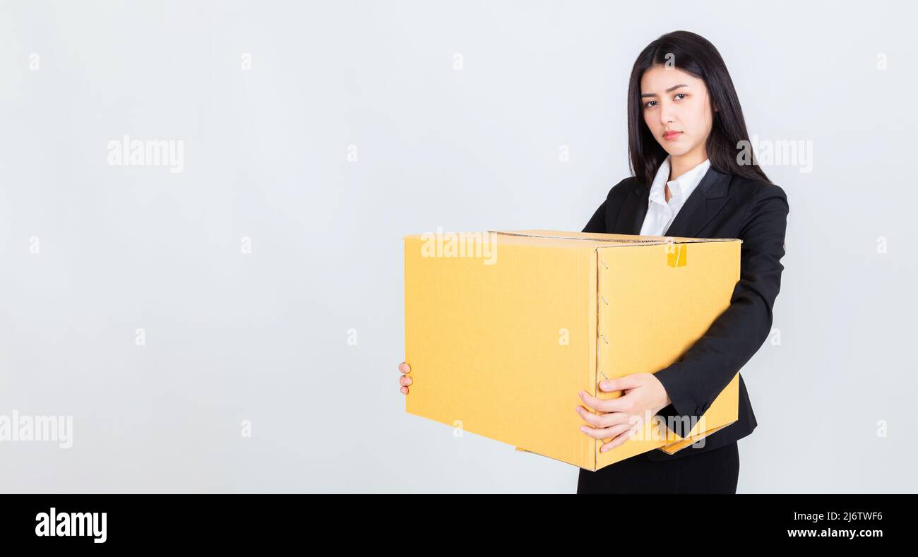Business woman holding brown box, fired from her job Stock Photo - Alamy