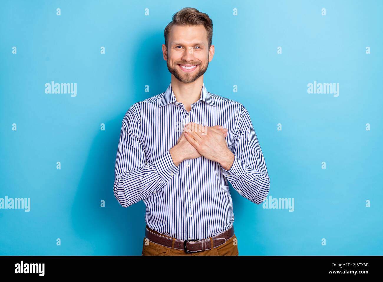 Portrait of positive friendly man hands palms heart toothy smile look ...