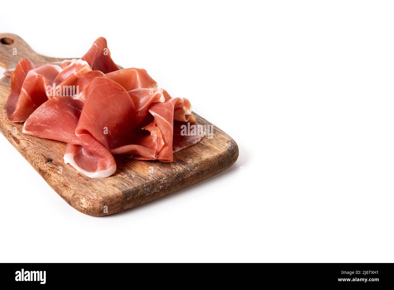 Spanish serrano ham isolated on white background Stock Photo - Alamy
