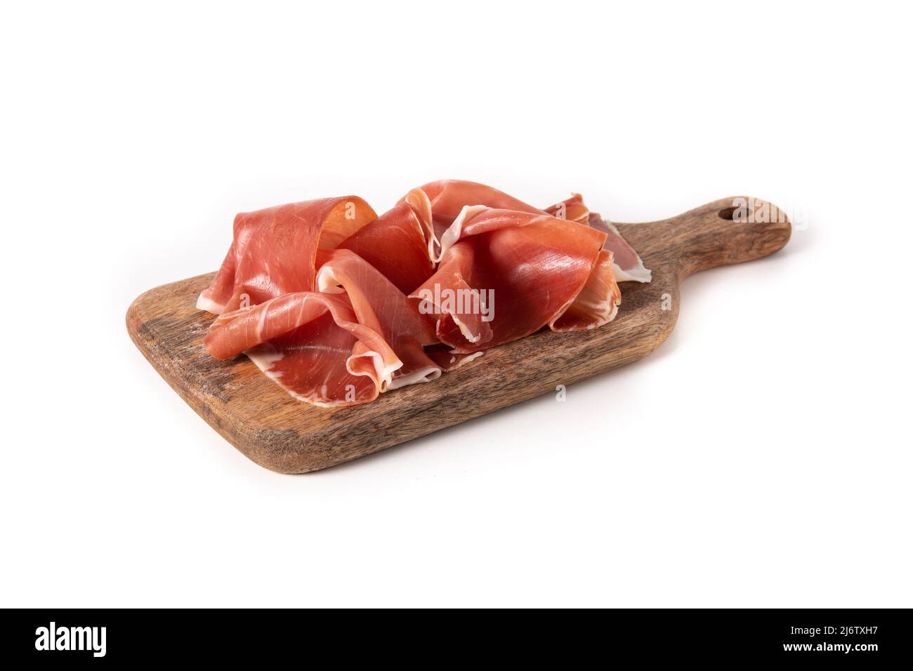 Spanish serrano ham isolated on white background Stock Photo - Alamy