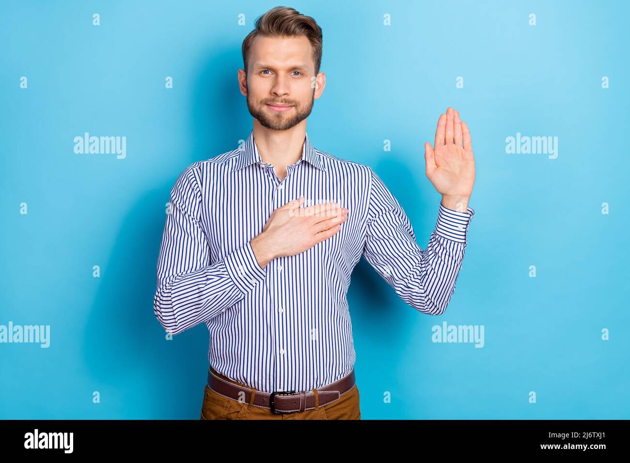 Photo of focused serious person arm palm heart promise swear look ...