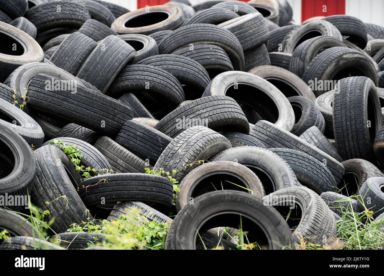 CHUMPHON, THAILAND-MAY 3, 2022 : Pile of used tires. Old tyres waste ...
